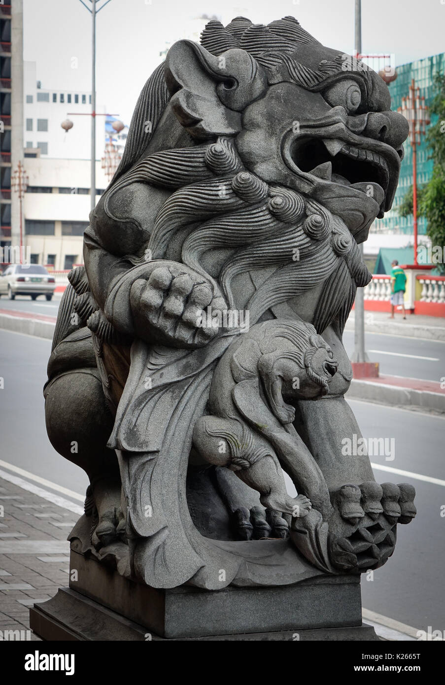 A lion statue on street at Chinatown in Manila, Philippines Stock Photo ...