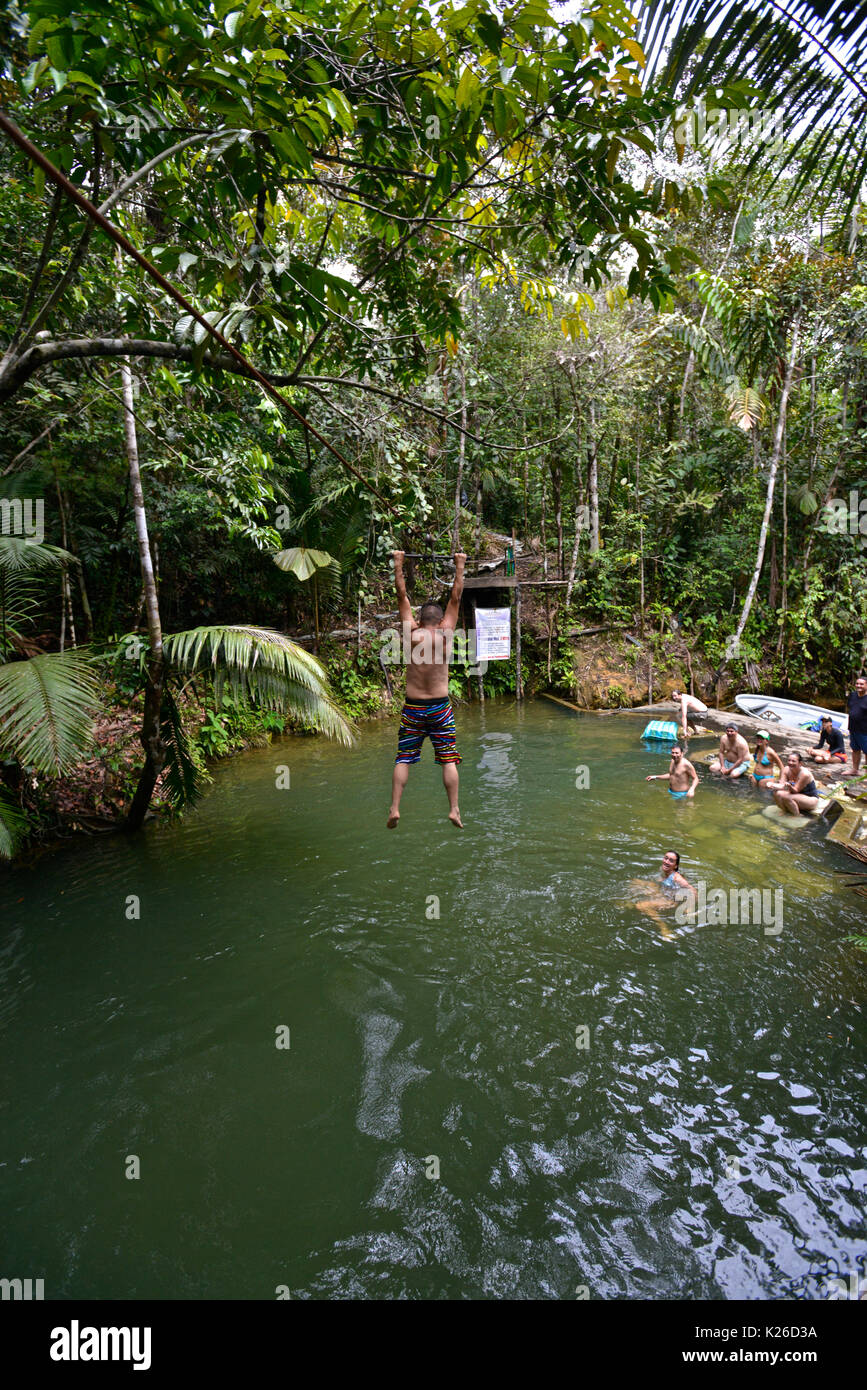 Tourist swim in a fresh water pool, National Natural Park of Uramba ...