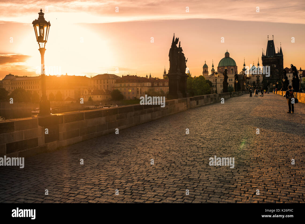 Sunset on Charles Bridge in Prague Stock Photo - Alamy