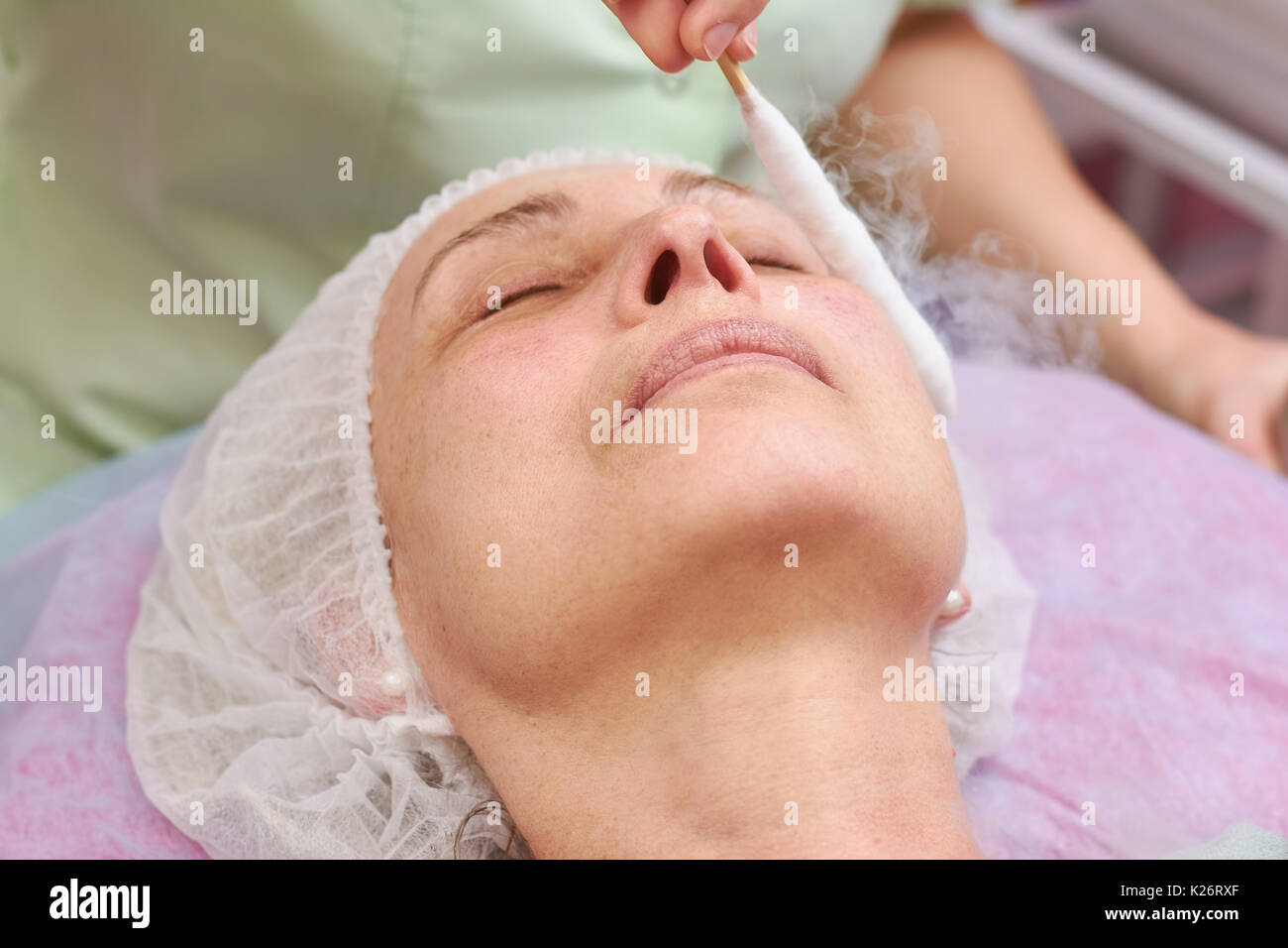 Face cryomassage, close up. Cosmetic liquid nitrogen therapy Stock ...