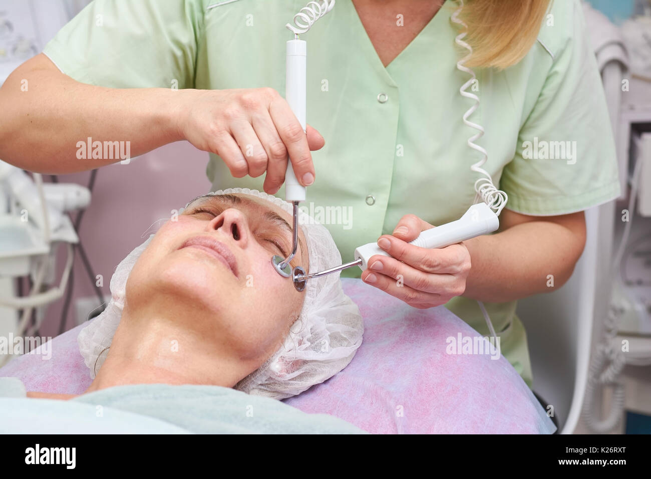 Microcurrent face treatment mature woman hi-res stock photography and ...