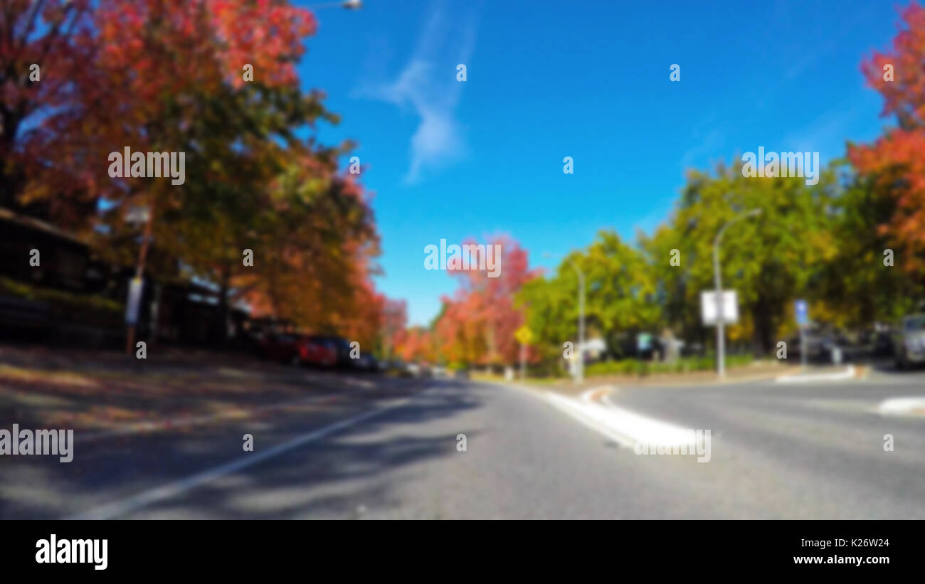 Blurred background of driving along streets with beautiful Autumn Fall ...