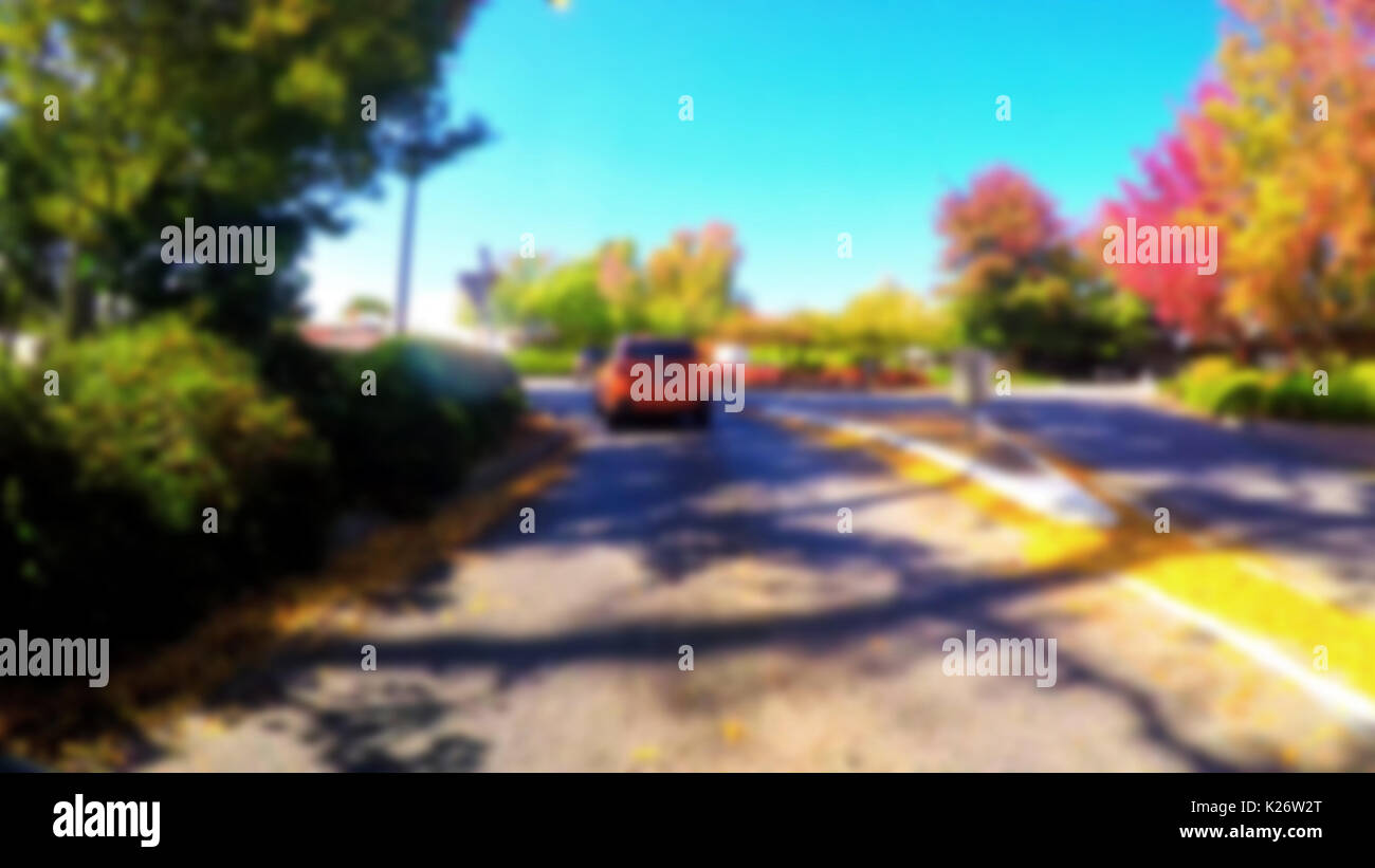 Blurred background of driving along streets with beautiful Autumn Fall ...