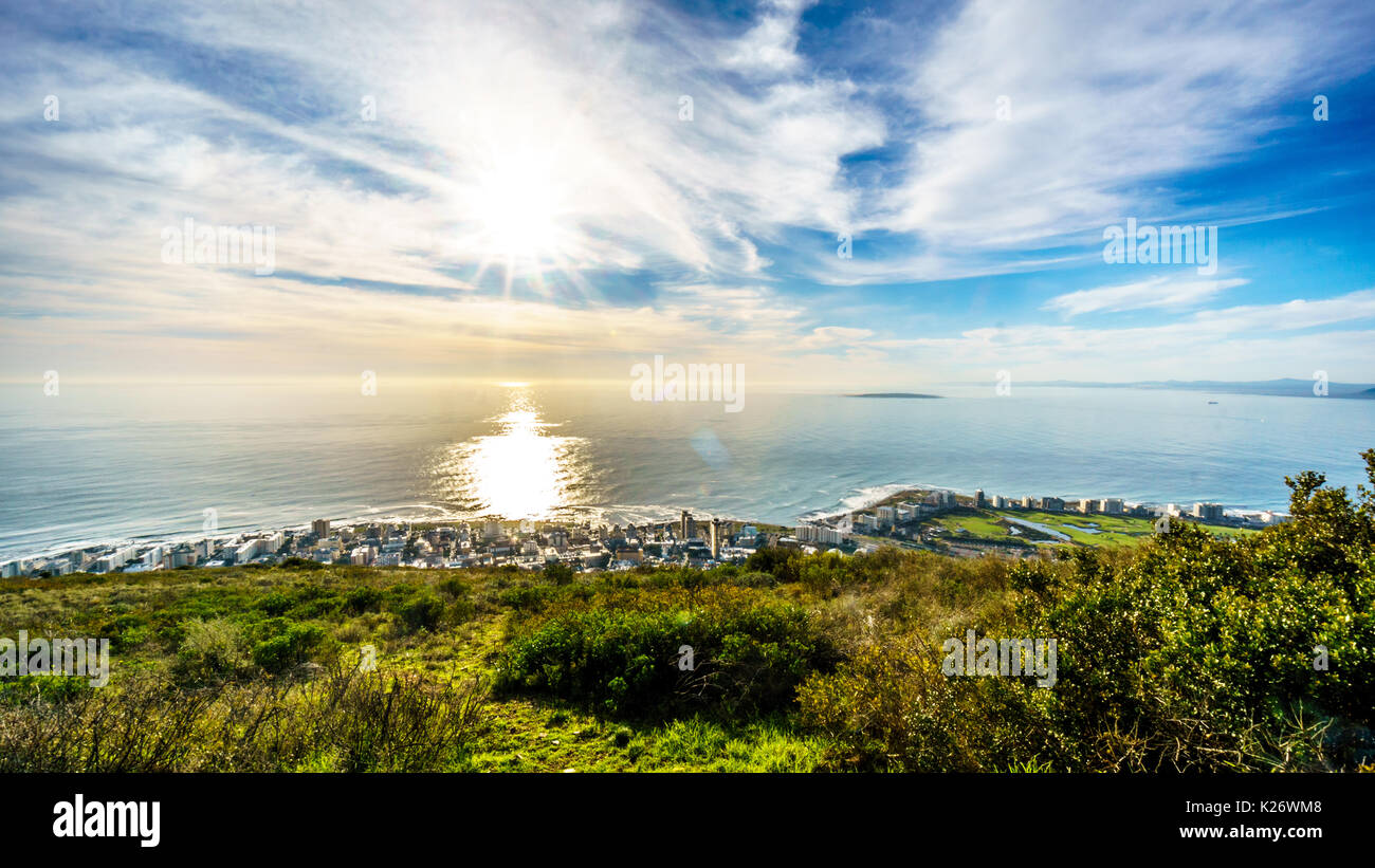 Sun setting over the Atlantic Ocean, Sea Point and Camps Bay. Viewed ...
