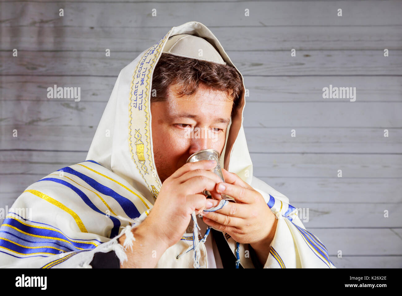 Jewish service items for Saturday Kiddush ceremony A Jewish man holds a ...