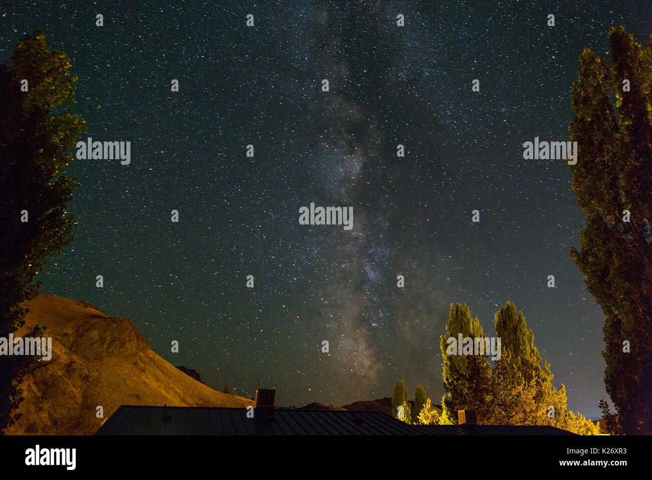 Milky Way over farm ranch in high deset Central Oregon on a starry ...