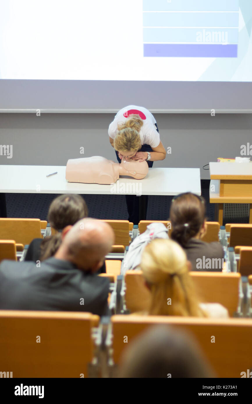 Instructor teaching first aid cardiopulmonary resuscitation workshop ...