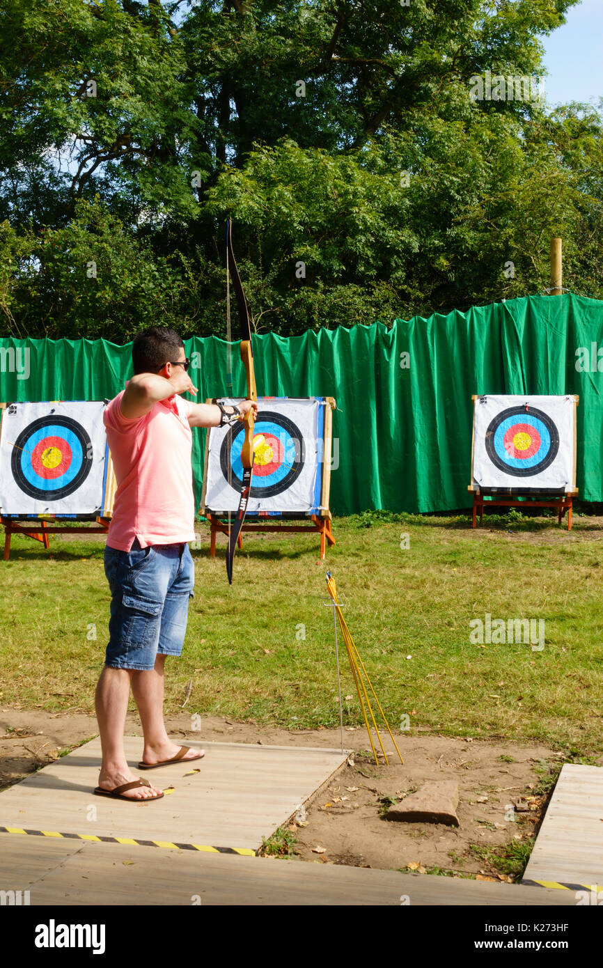 An adult male archer with targets Stock Photo - Alamy