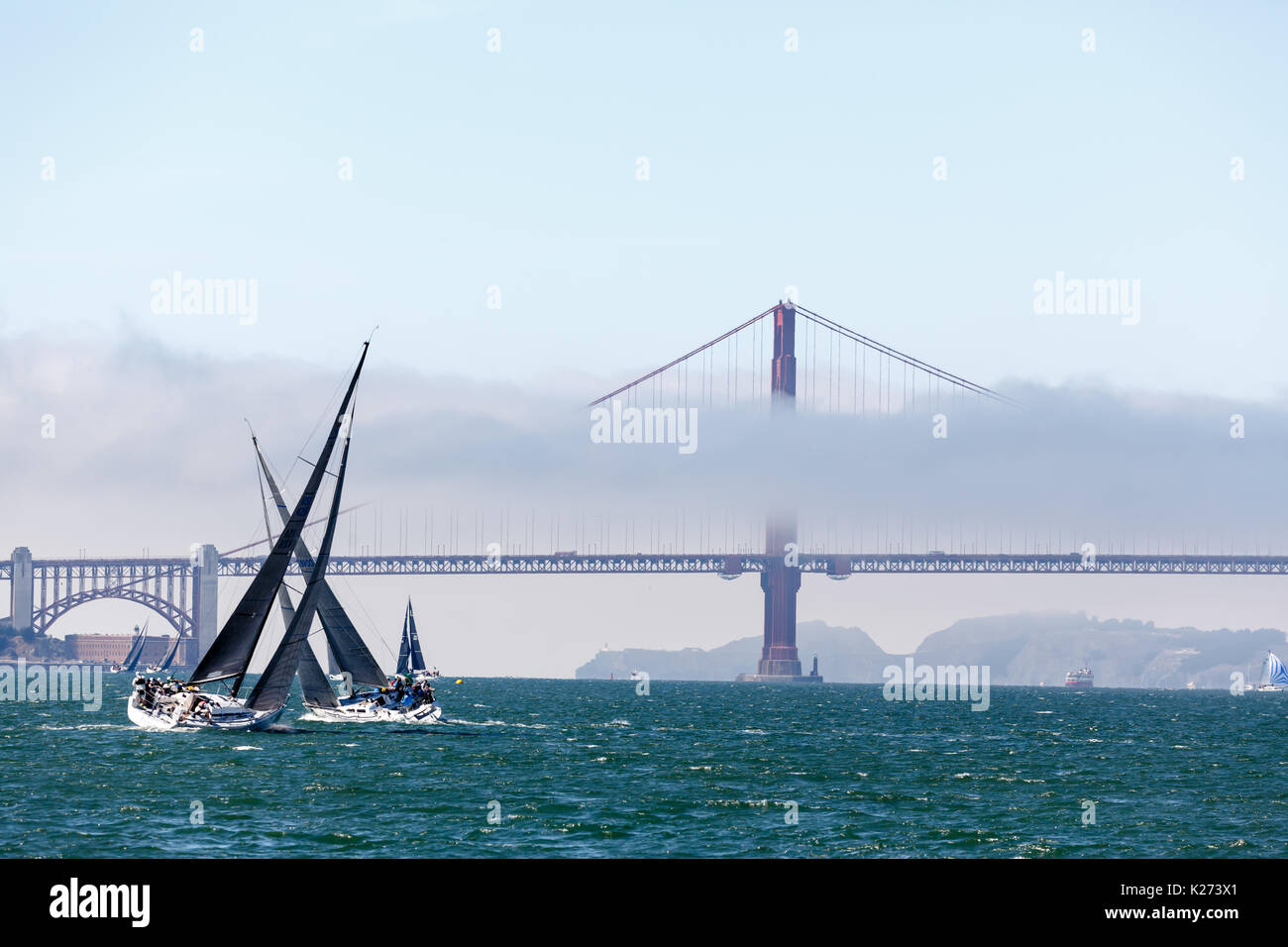 Two boats sails cross as one tacs to change course Stock Photo - Alamy