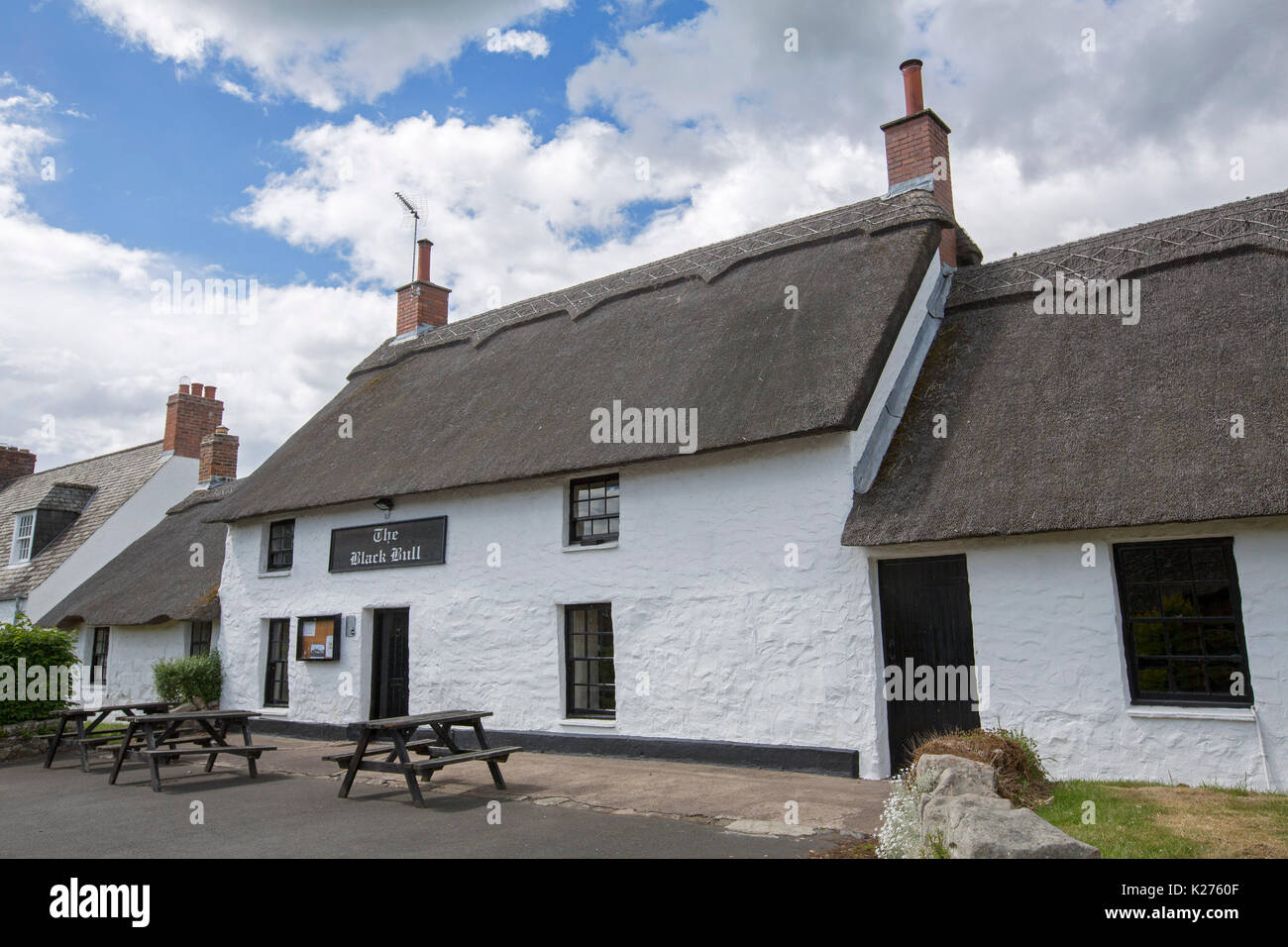 Traditional British pub, The Black Bull, with white washed walls and ...