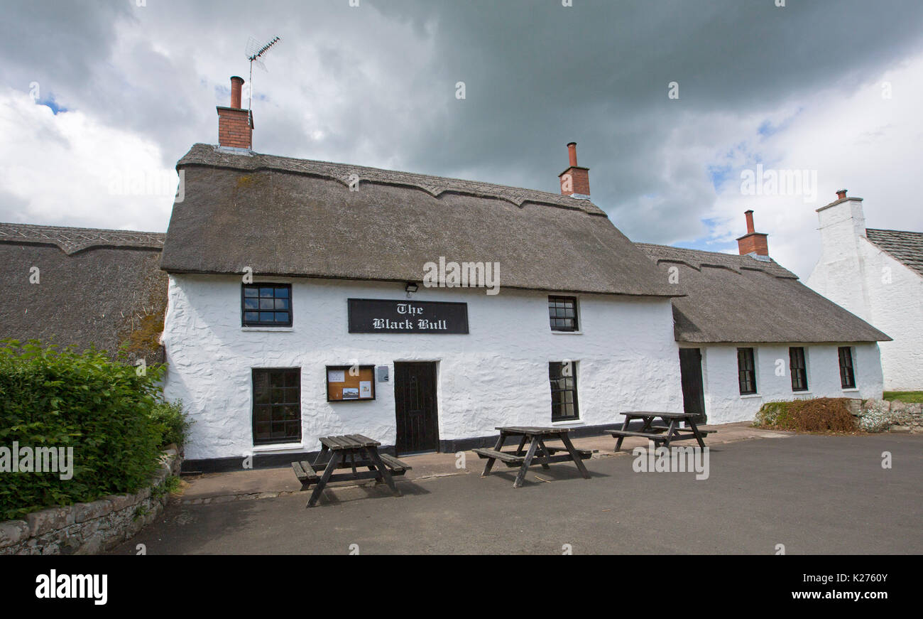 Traditional British pub, The Black Bull, with white washed walls and ...