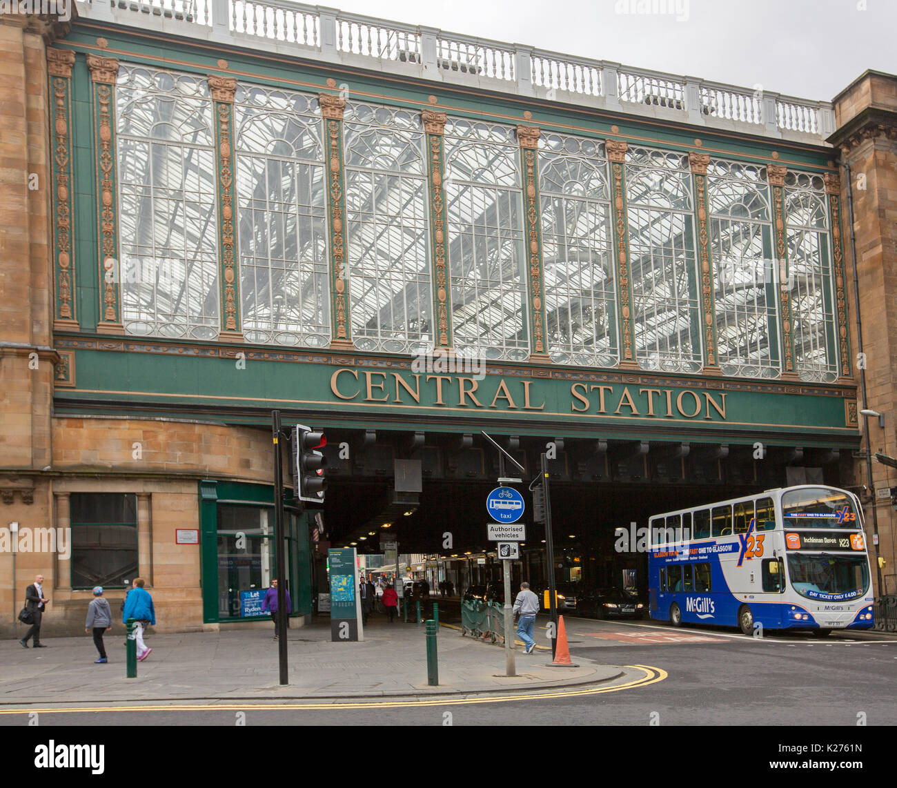 Historic central railway station entrance with double decker bus ...