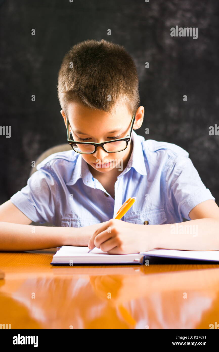 Kids doing homework table hi-res stock photography and images - Alamy