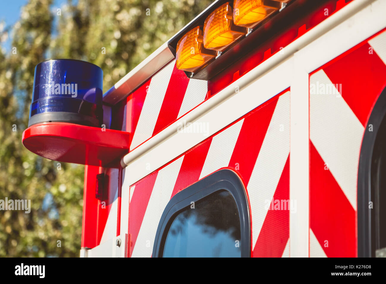 blue flashing light on a red ambulance firefighters Stock Photo - Alamy