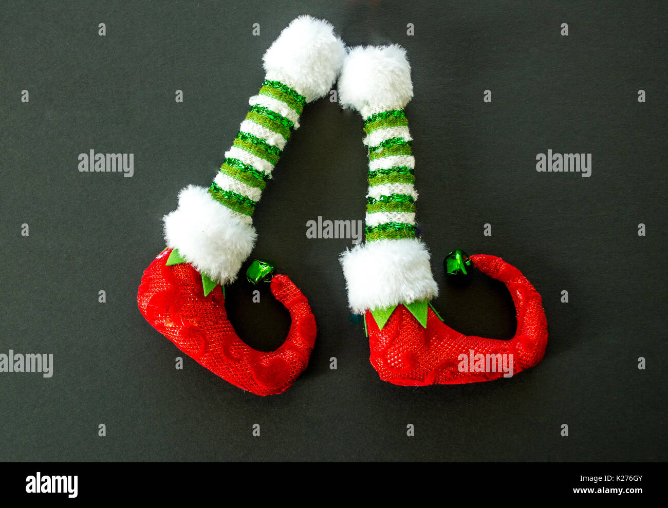 red, white and green Christmas elf boots isolated on gray Stock Photo ...