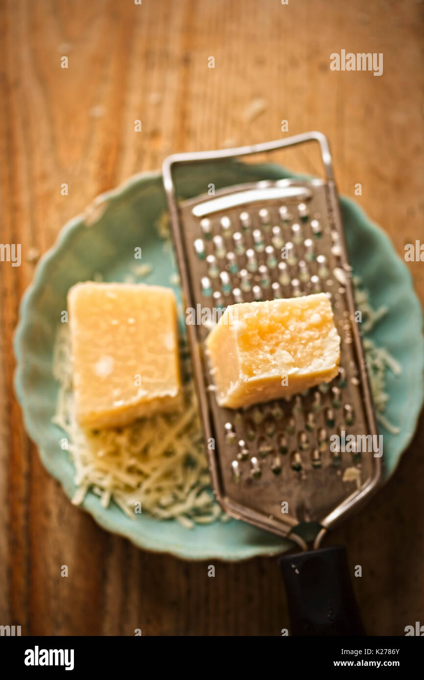 Parmesan cheese with grater Stock Photo - Alamy