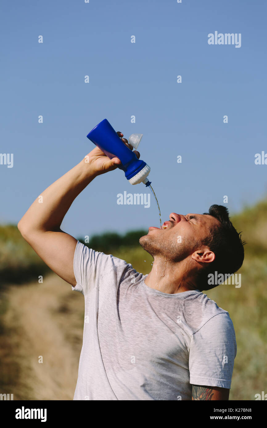 Natural young man pouring drinking hi-res stock photography and images ...