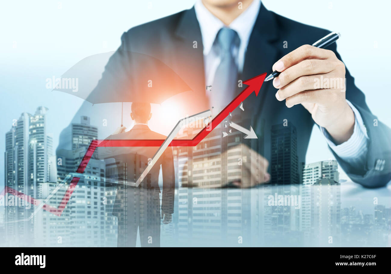 Businessman point at increasing graph and decreasing broken graph with ...