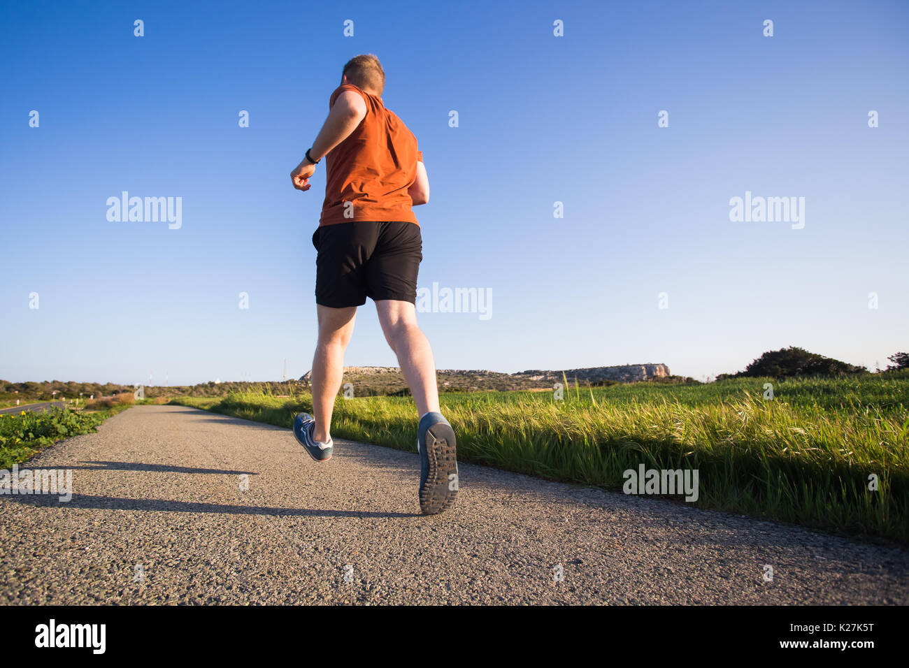 Outdoor cross-country running in summer sunshine concept for exercising ...