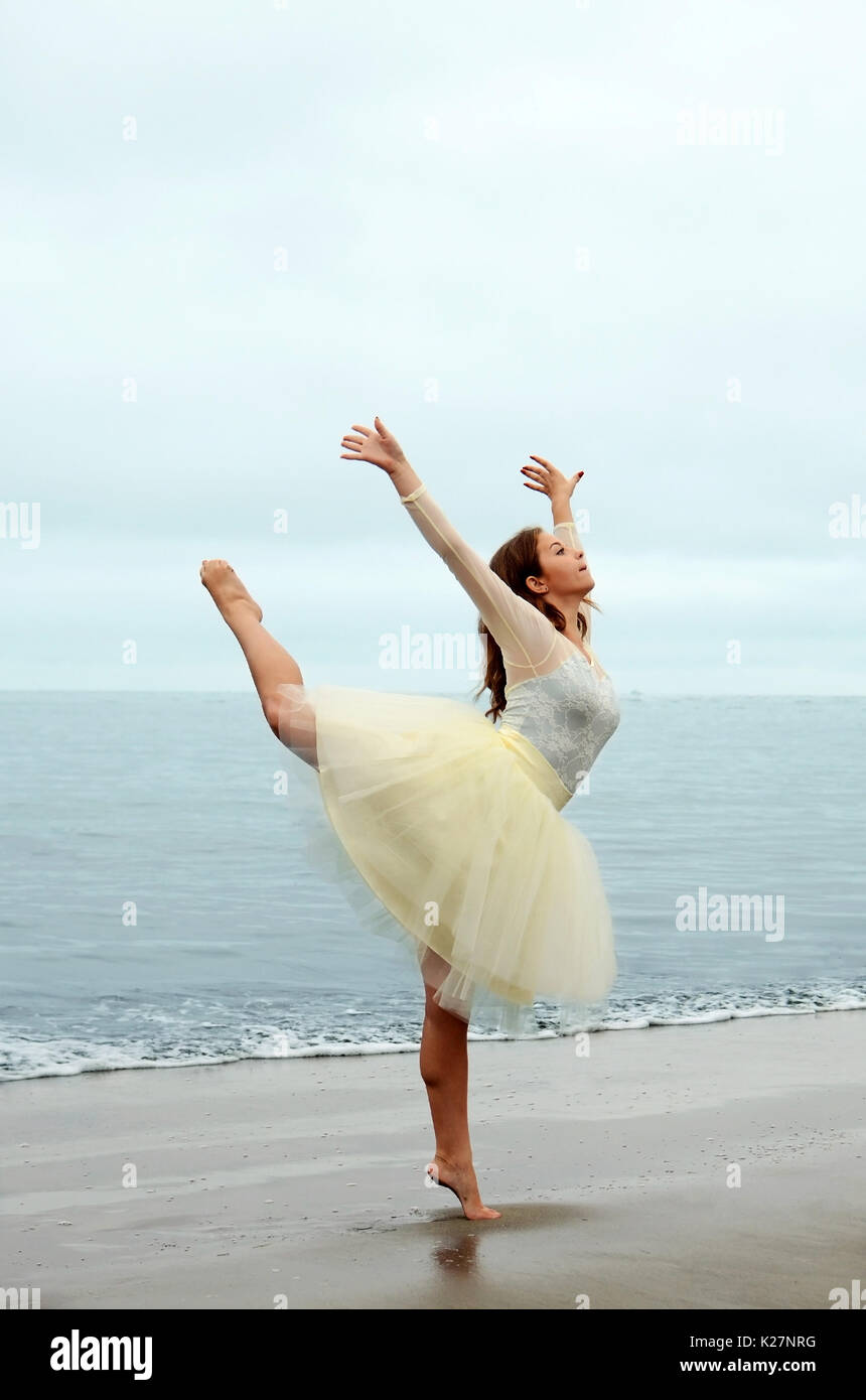 Ballerina leaping on beach Stock Photo - Alamy