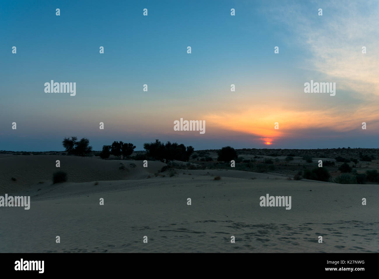 Wide angle picture of colorful sunset in Thar Desert, located close to ...