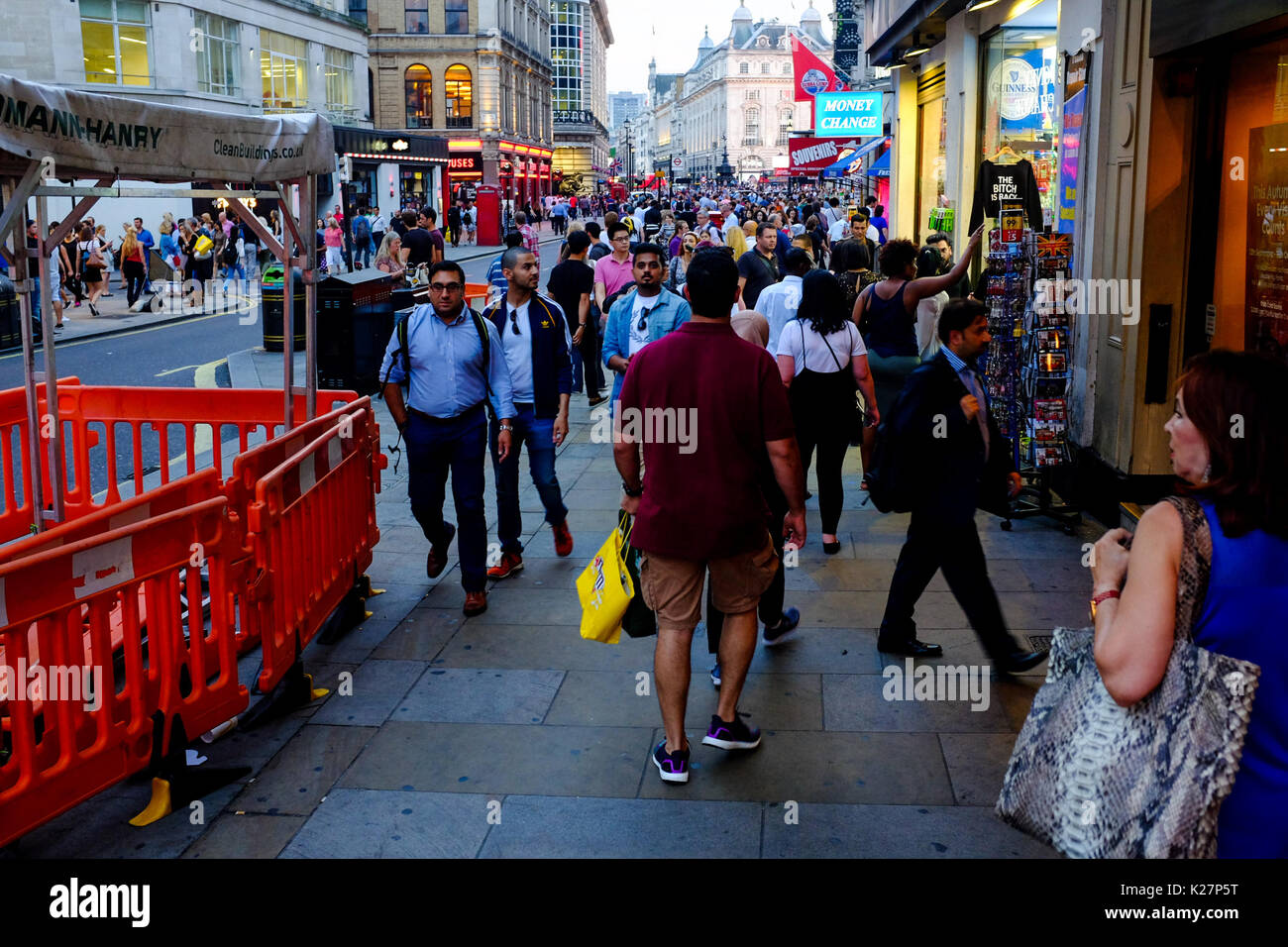 People and crowds are seen on the West End section of London, England ...