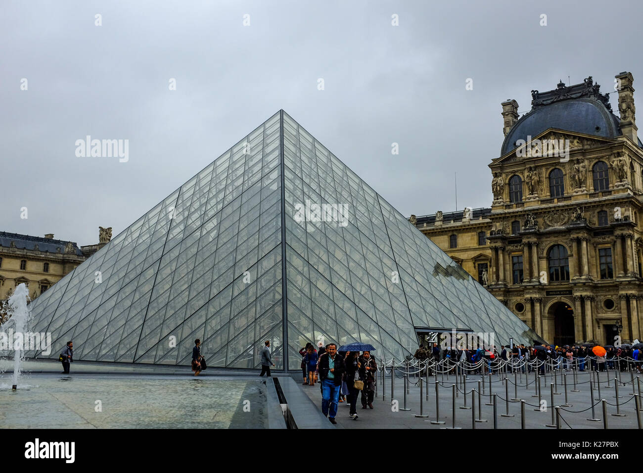 Interior and exterior photographs of The Louvre, including art, crowds ...