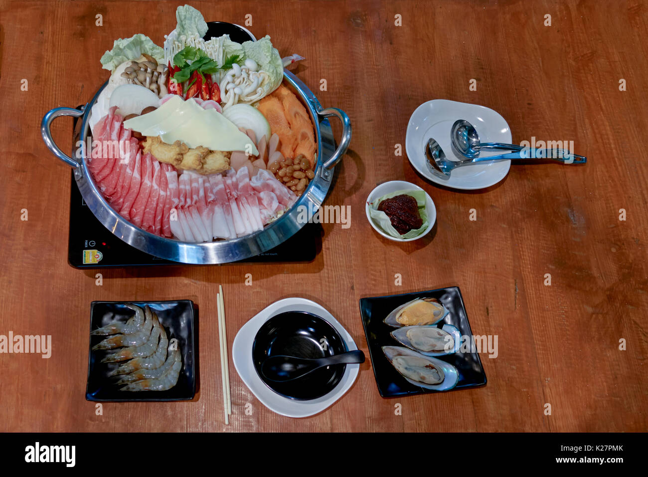 Shabu hot pot set. Japanese traditional food served raw on a hot plate ...