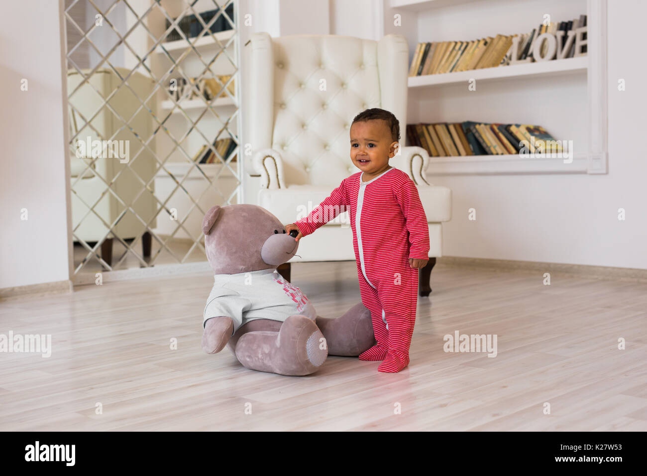 Cute curious baby in the room Stock Photo - Alamy