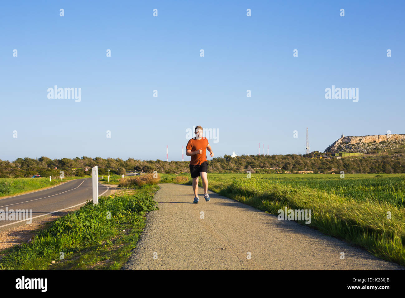 Athletic young man running in the nature. Healthy lifestyle Stock Photo ...