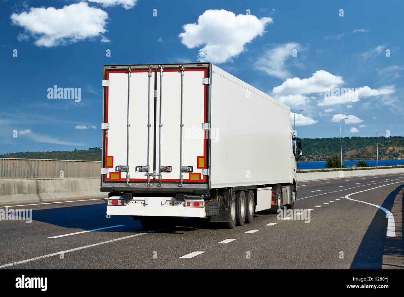 Trucks with cargo on highway, shipping and transportation concept Stock ...
