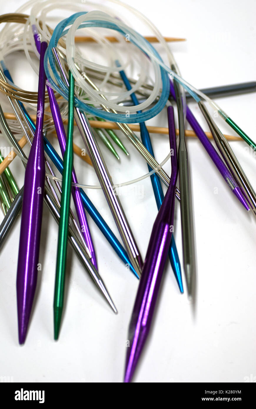 Collection of knitting needles on a white background Stock Photo - Alamy