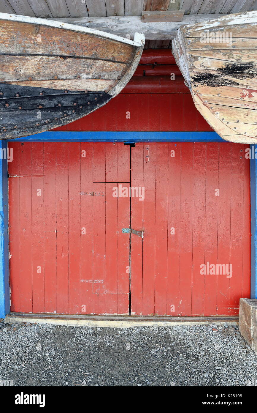Old fishing boats hanging from the ceiling of the porch-front side of ...