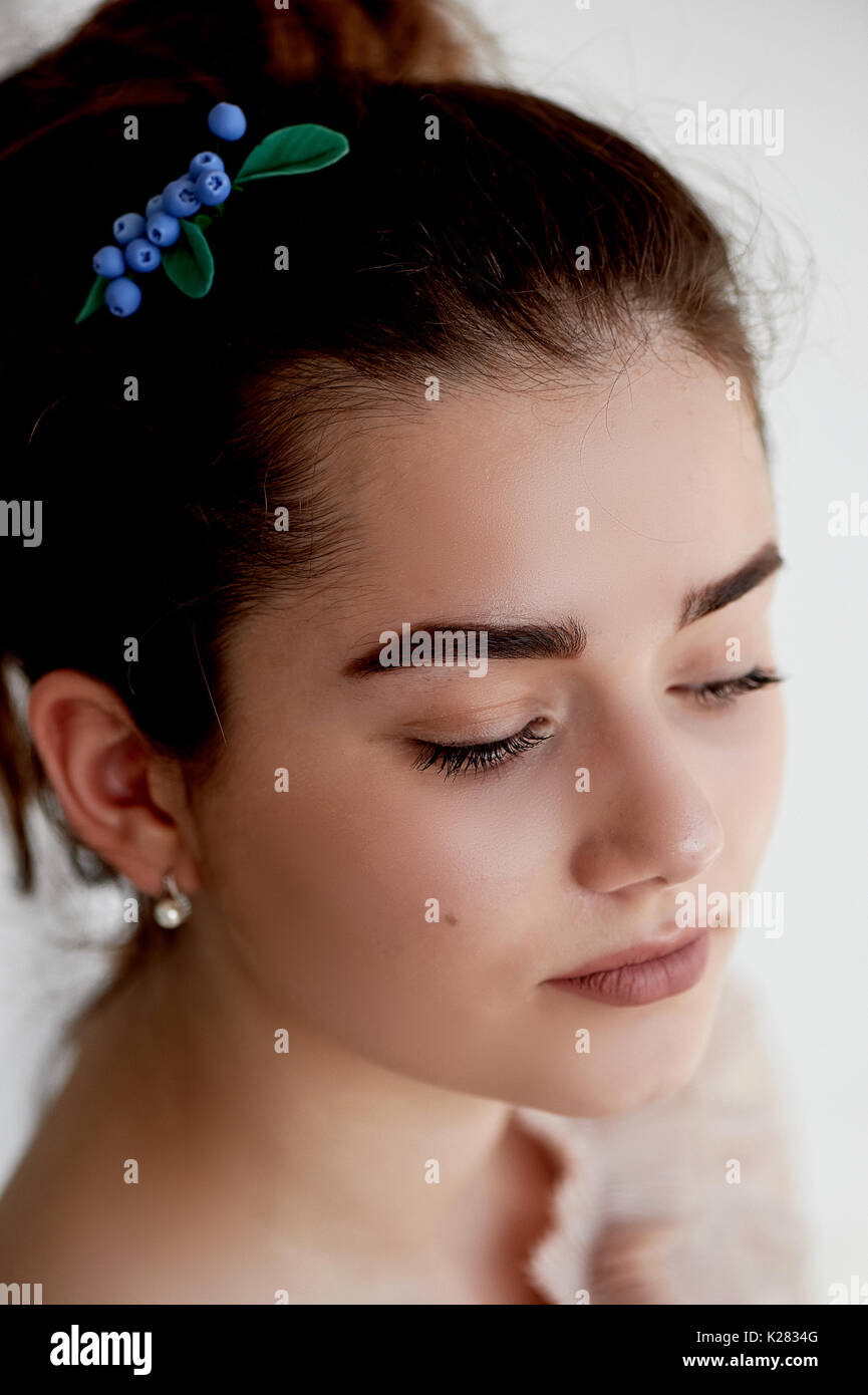 Portrait of beautiful girl with dark hair and light porcelain skin ...