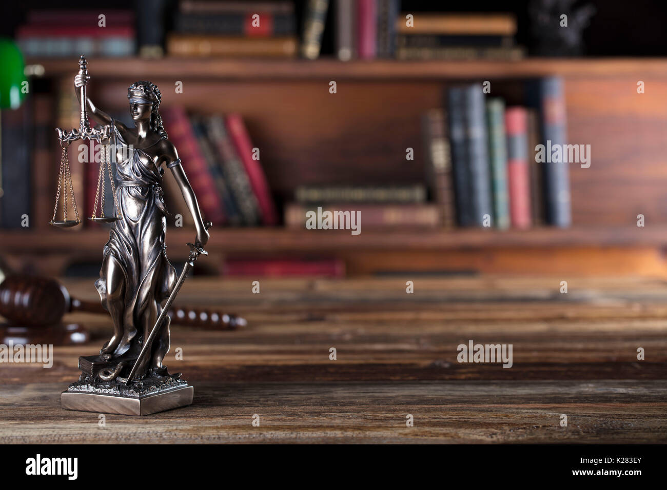 Law symbols. Statue of justice in the court library Stock Photo - Alamy