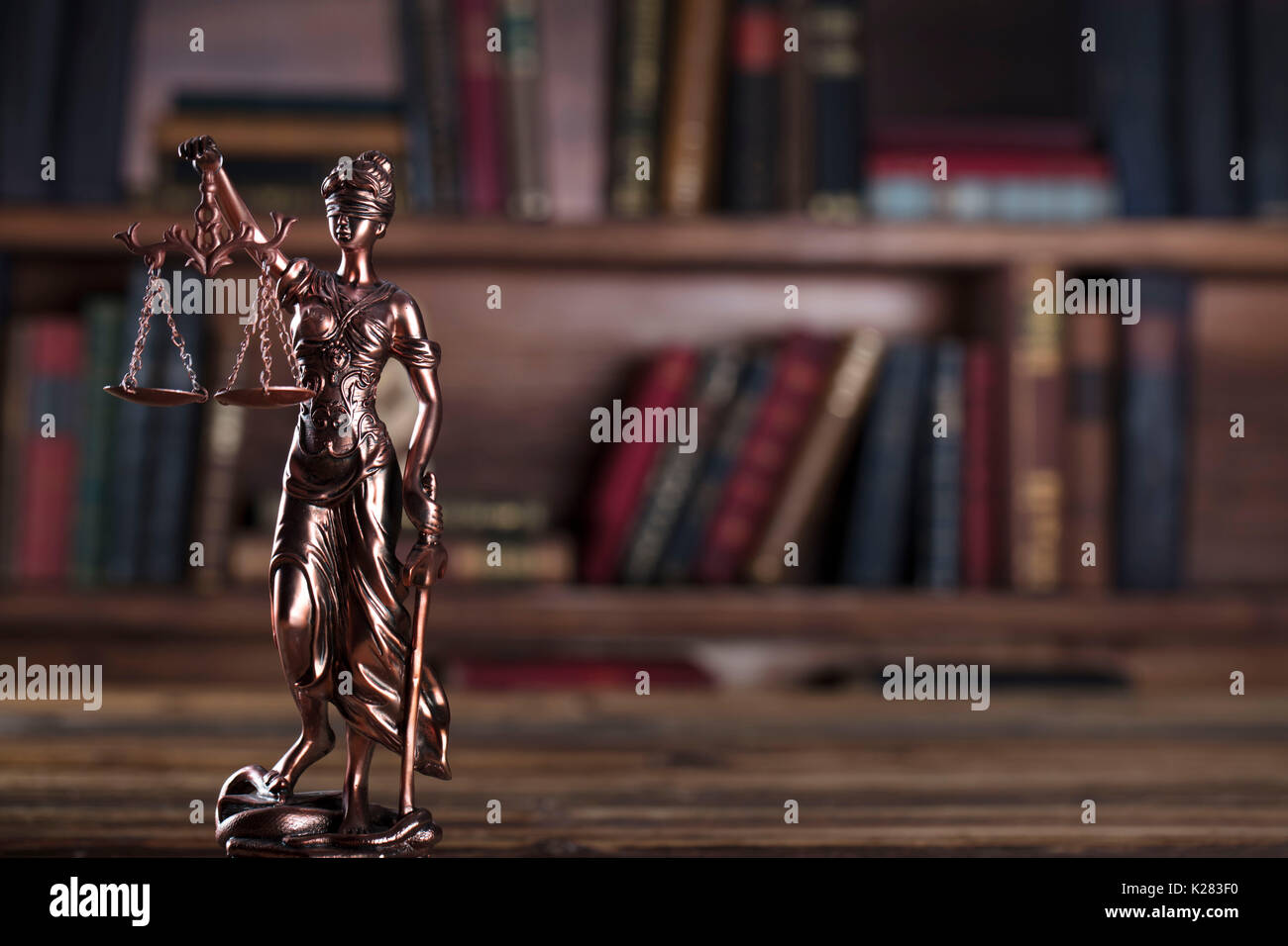 Law symbols. Statue of justice in the court library Stock Photo - Alamy