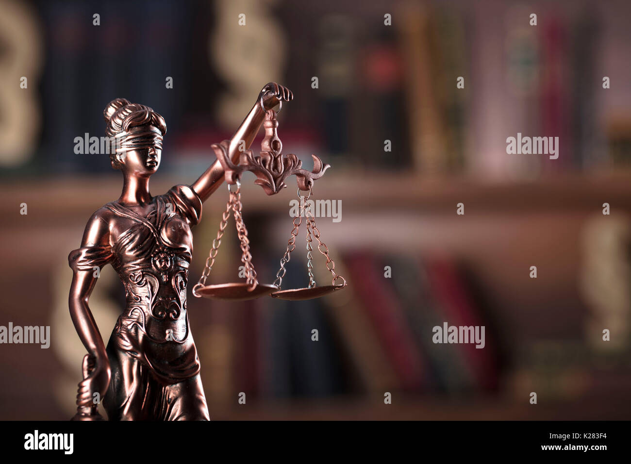 Law symbols. Statue of justice in the court library Stock Photo - Alamy