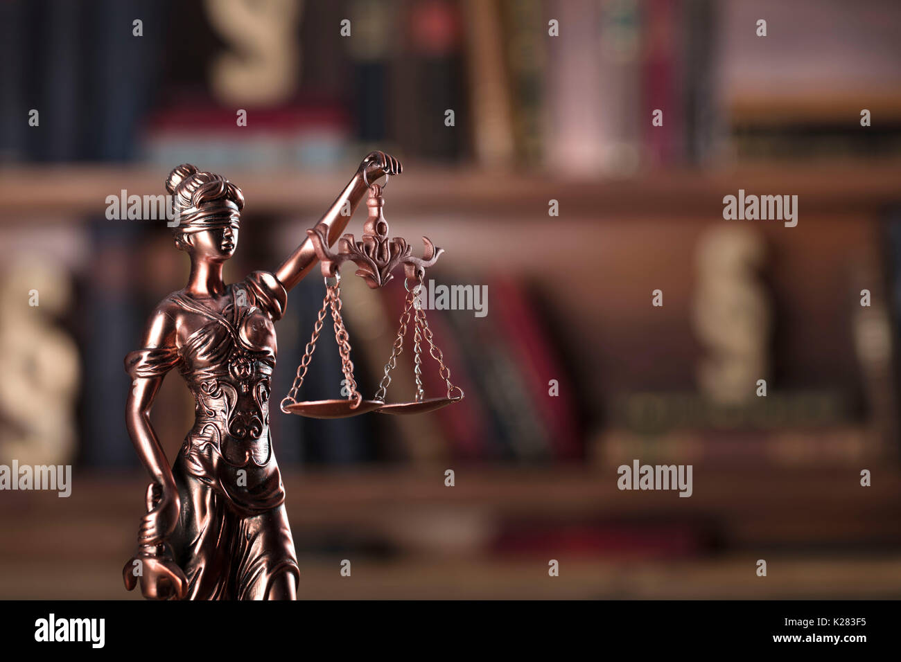 Law symbols. Statue of justice in the court library Stock Photo - Alamy