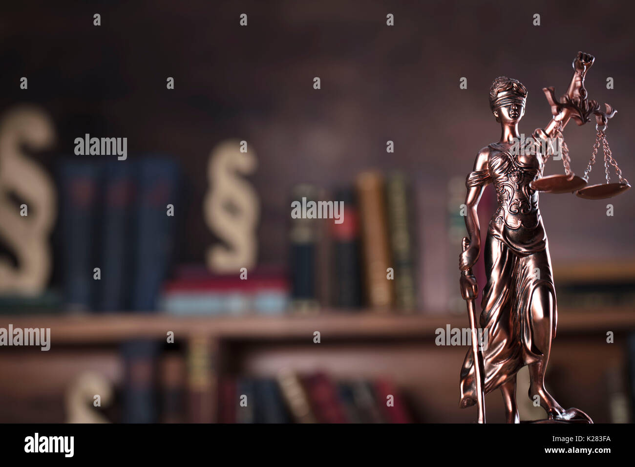 Law symbols. Statue of justice in the court library Stock Photo - Alamy