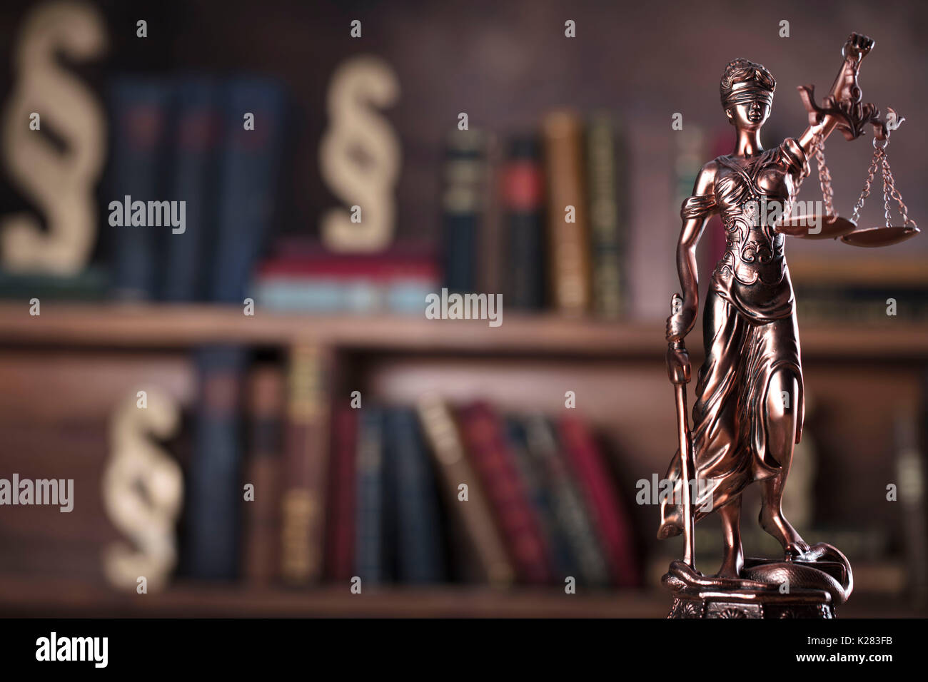 Law symbols. Statue of justice in the court library Stock Photo - Alamy