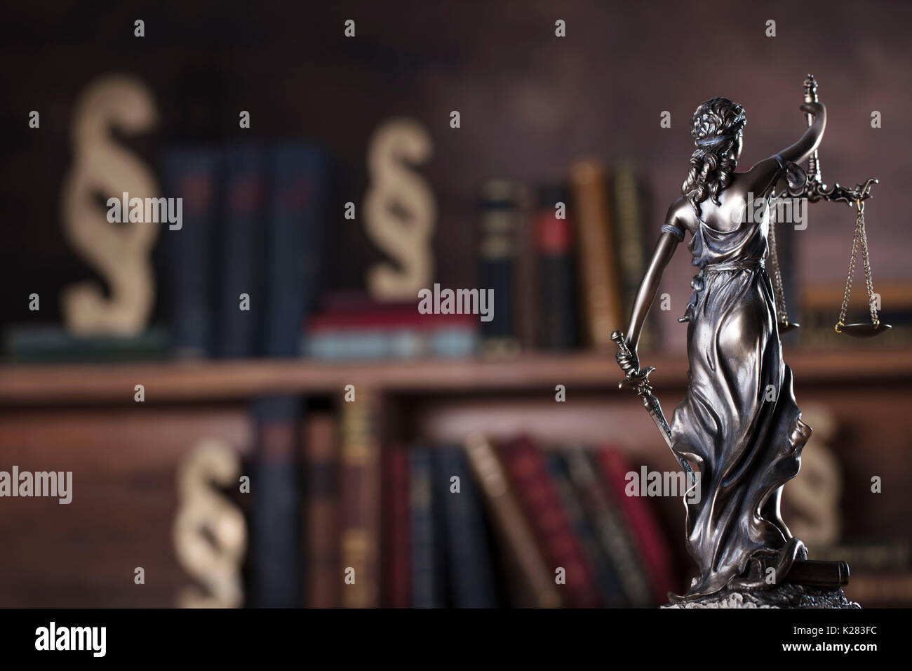 Law symbols. Statue of justice in the court library Stock Photo - Alamy