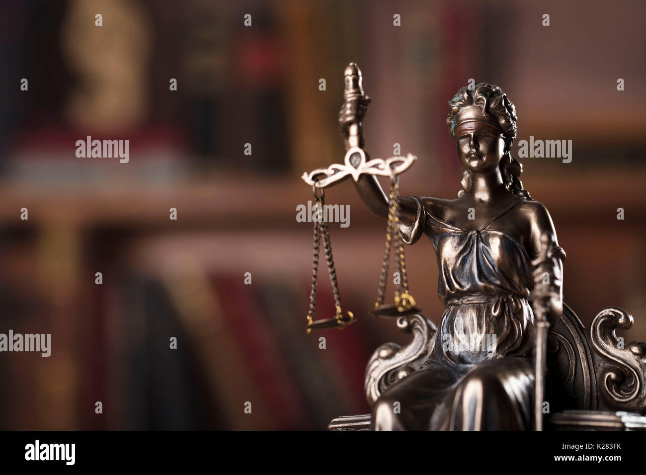 Law symbols. Statue of justice in the court library Stock Photo - Alamy