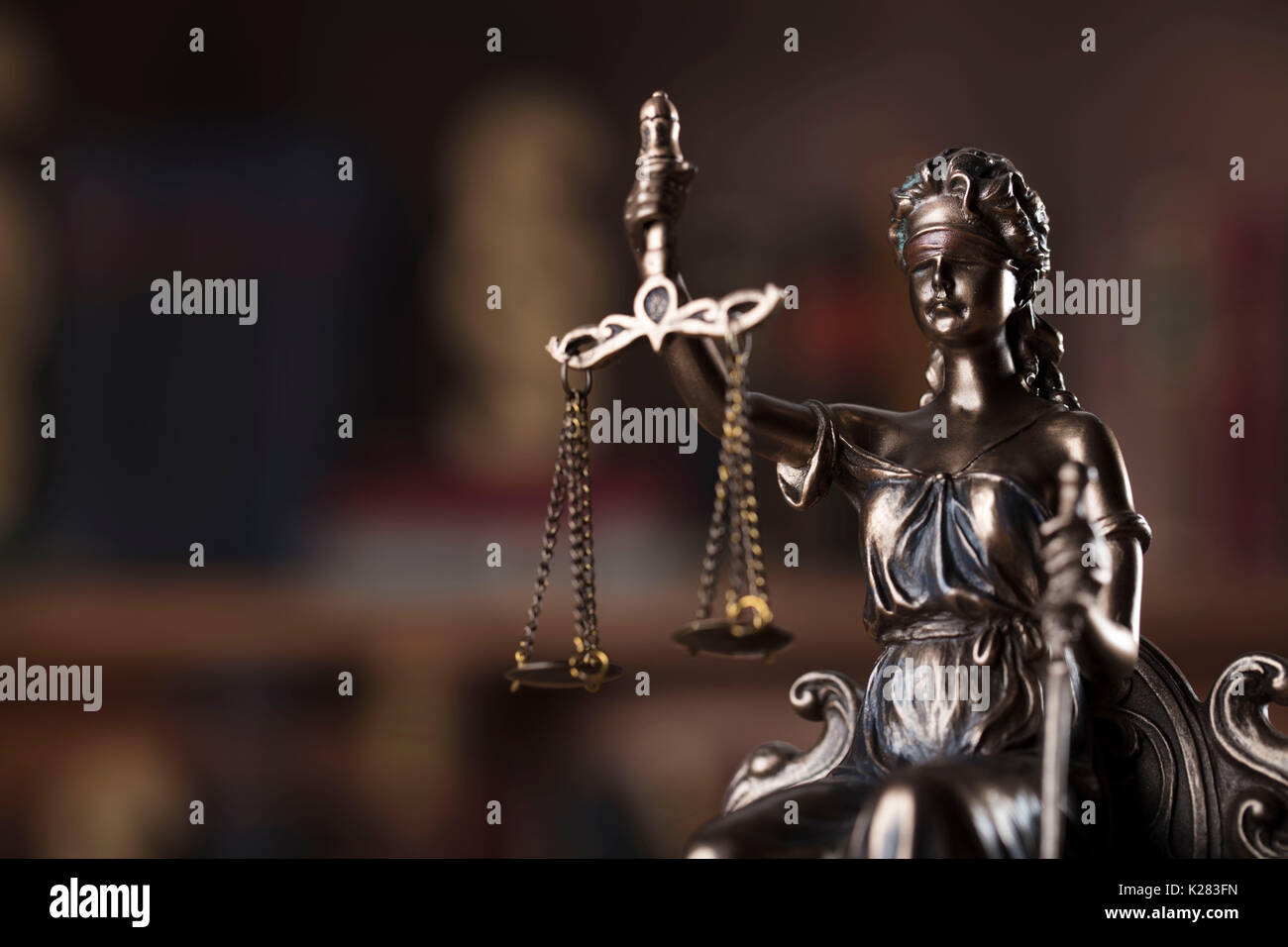 Law symbols. Statue of justice in the court library Stock Photo - Alamy