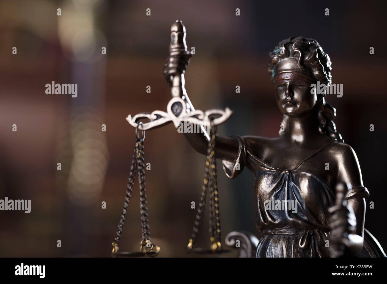 Law symbols. Statue of justice in the court library Stock Photo - Alamy