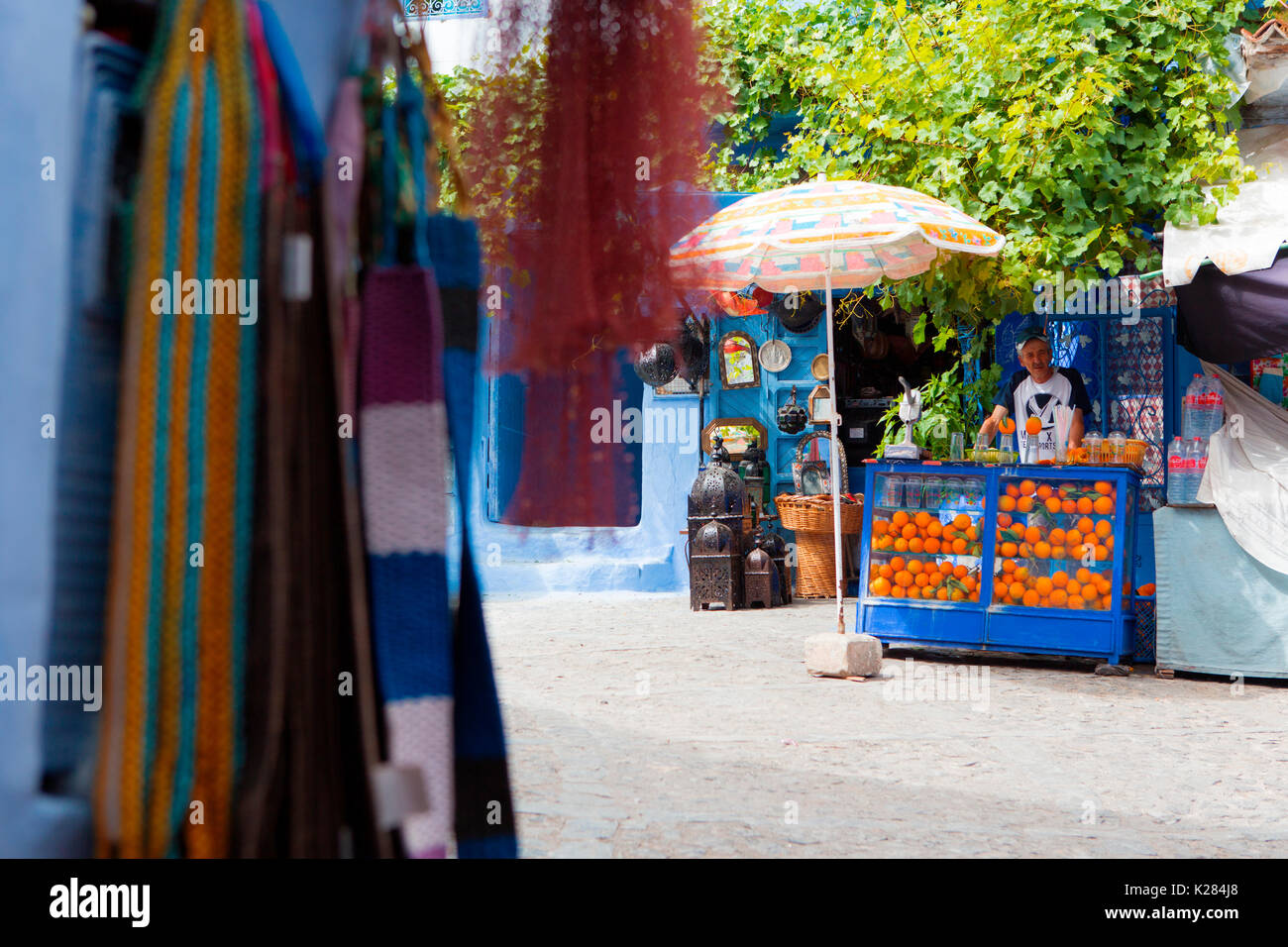 North Africa, Morocco,Chefchaouen district. Merchant of orange juice ...