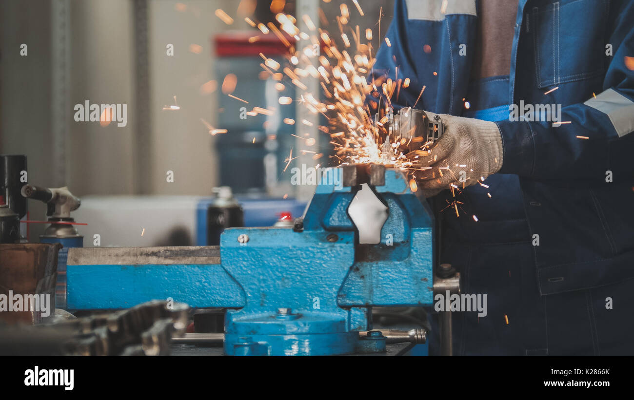 Worker in automobile factory grinding hi-res stock photography and ...