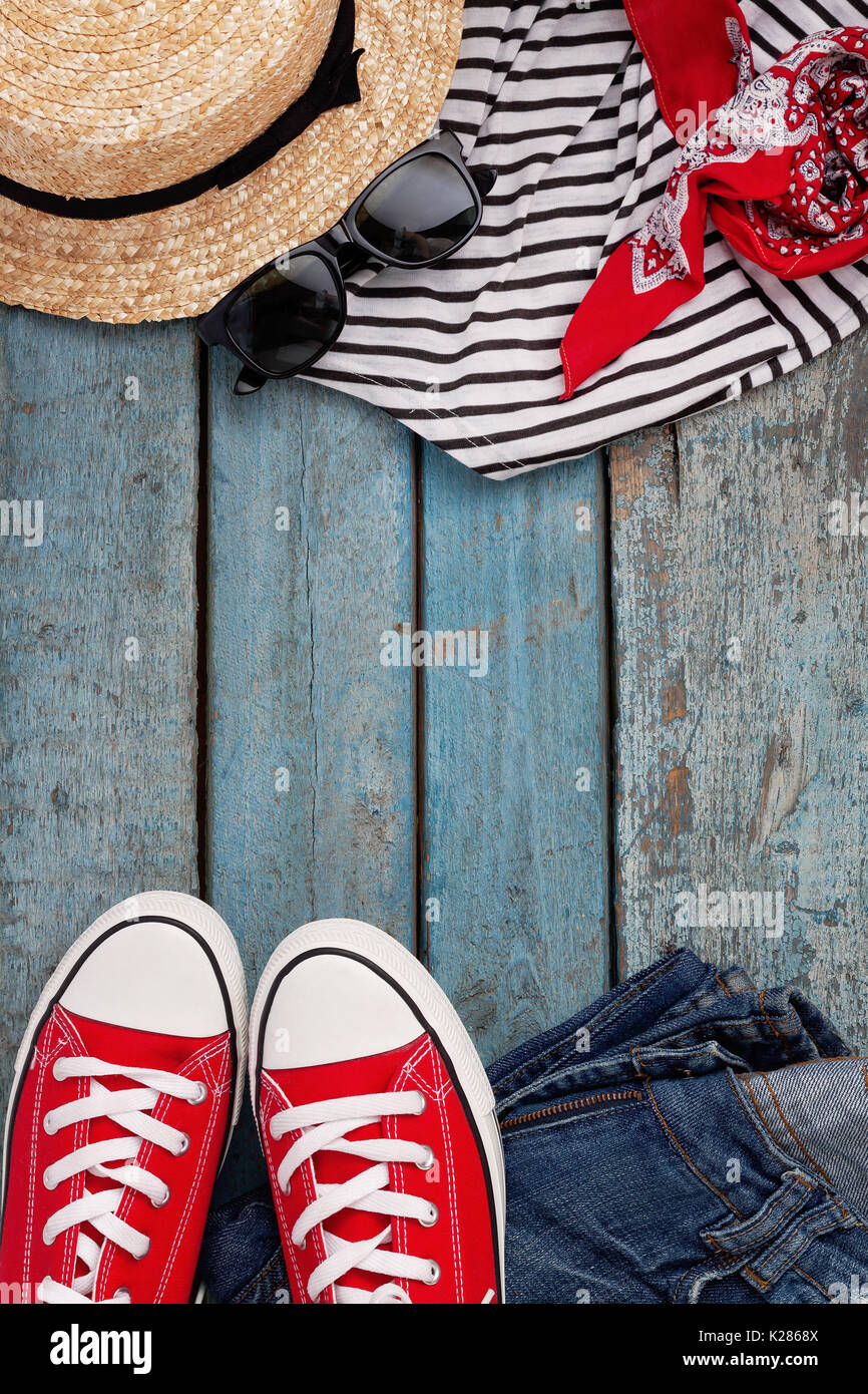 Still life of various items for recreation, clothing, hat, sneakers ...