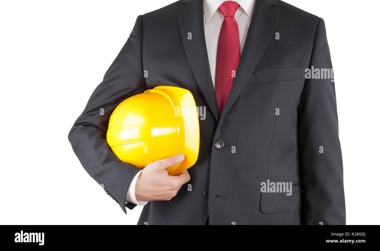 Engineer in black suit holding yellow helmet isolated on white with ...
