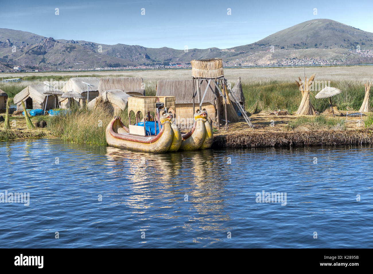 Uros floating Island made from totora reed with Puno in background Lake ...