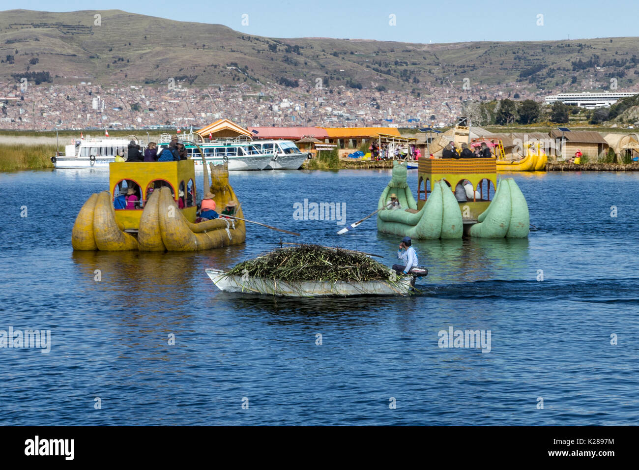 Reed boats and transporting reeds from Uros floating Island made from ...